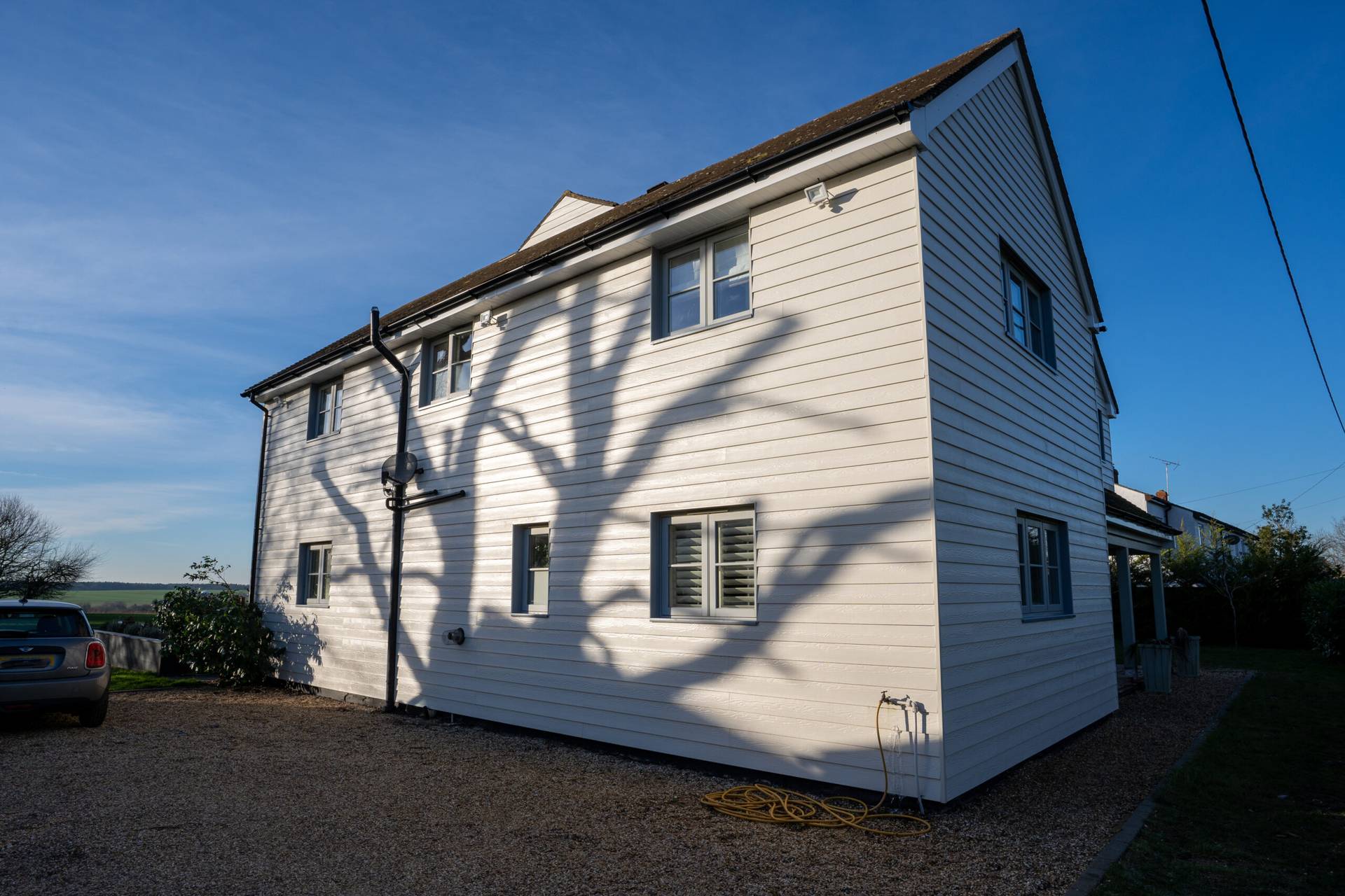 Cream White Delight – A Cedral Cladding Transformation